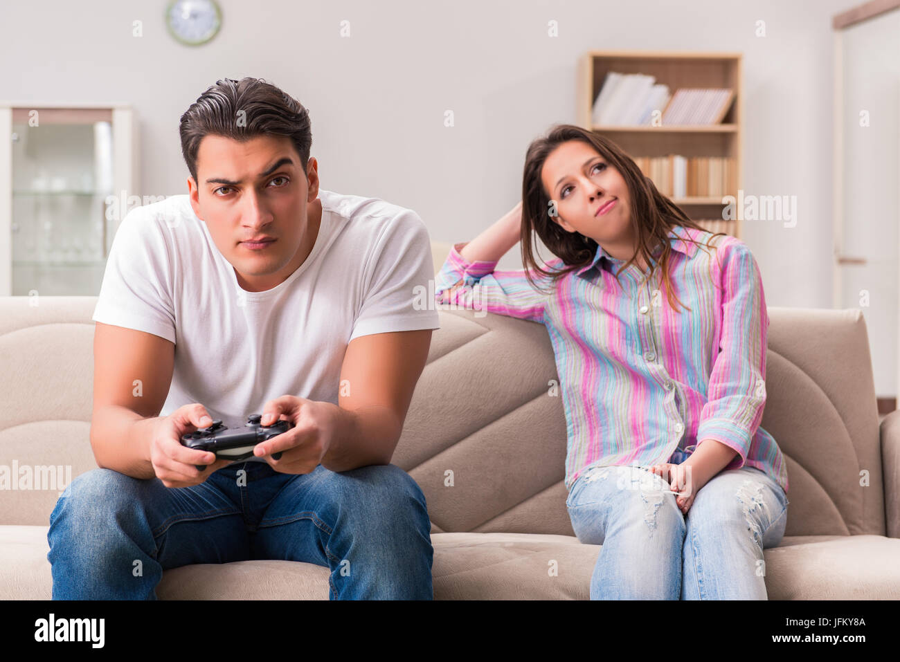 Young family suffering from computer games addiction Stock Photo - Alamy