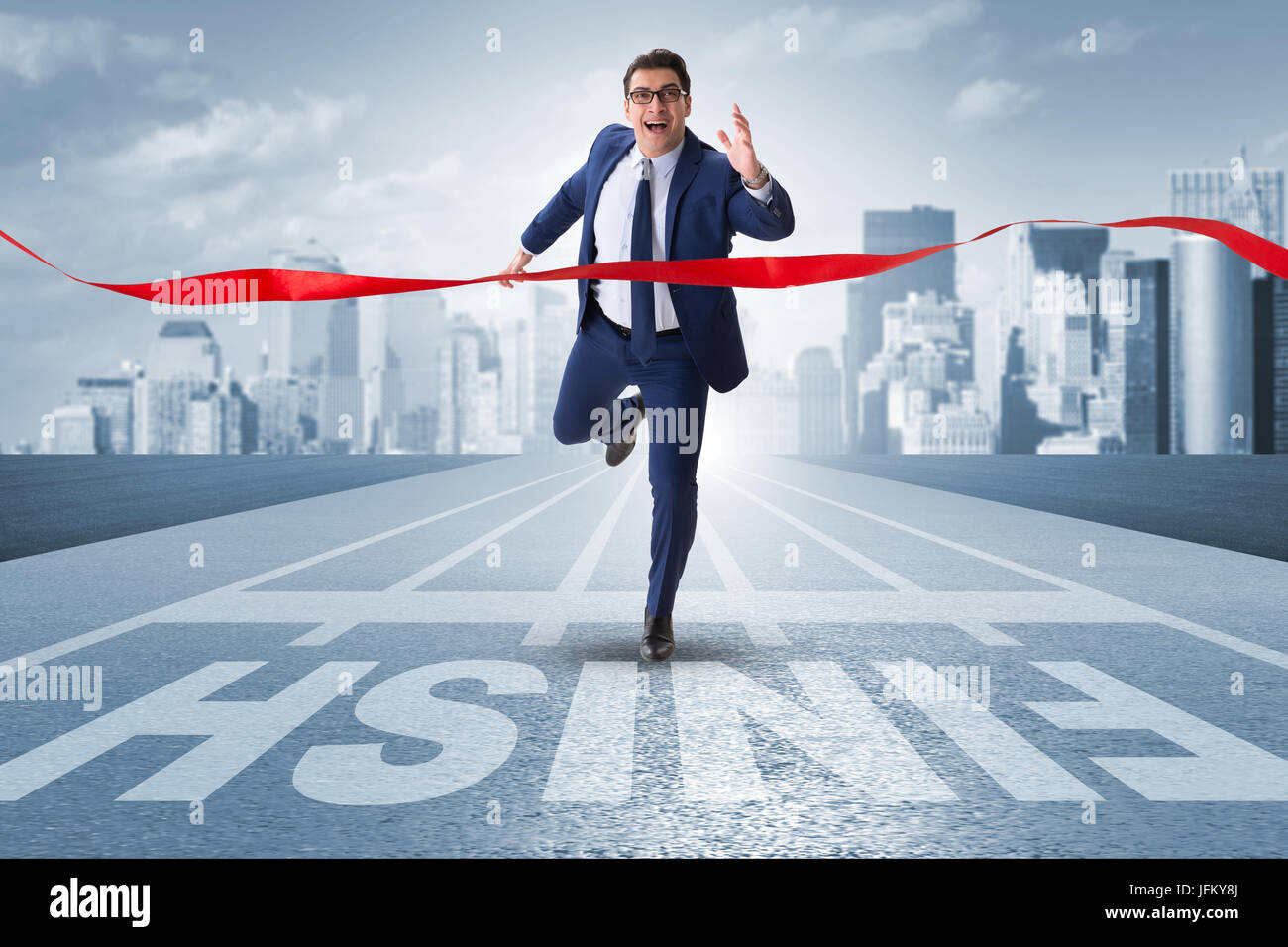 Businessman on the finishing line in competition concept Stock Photo ...