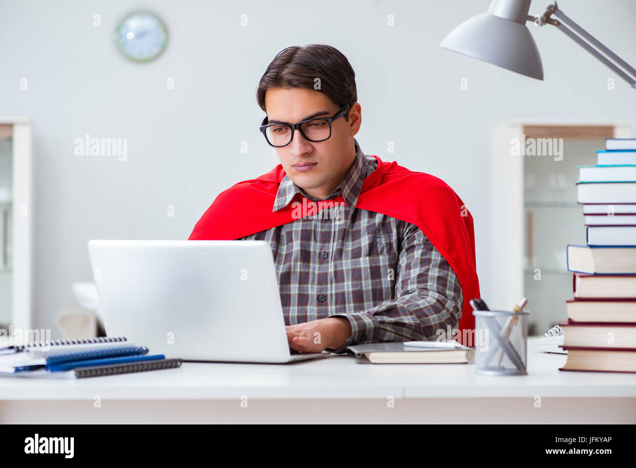 Super hero student with books studying for exams Stock Photo - Alamy