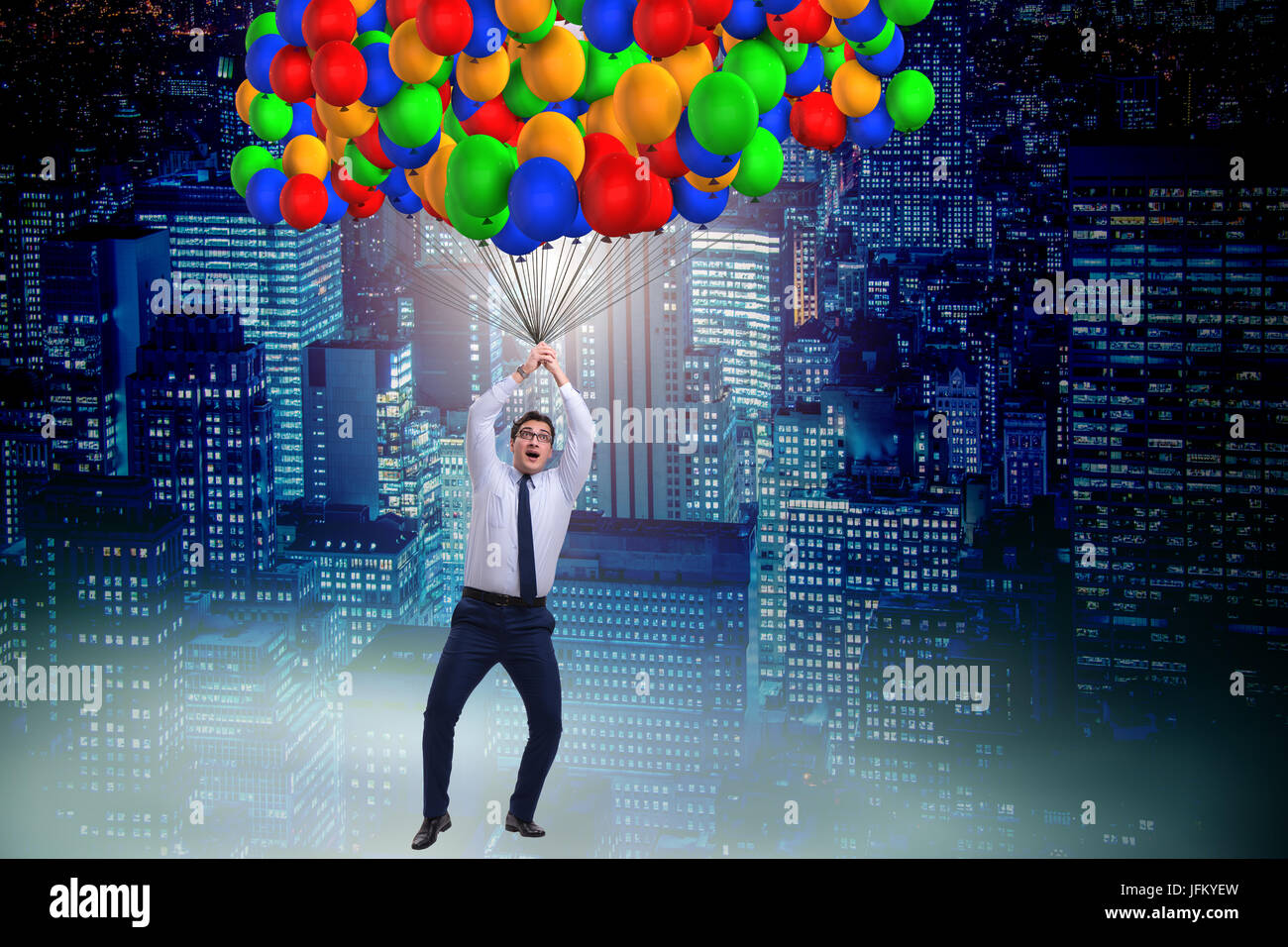 Businessman flying on balloons in challenge concept Stock Photo - Alamy
