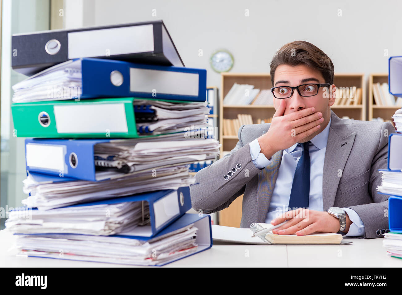 Busy businessman under stress due to excessive work Stock Photo - Alamy