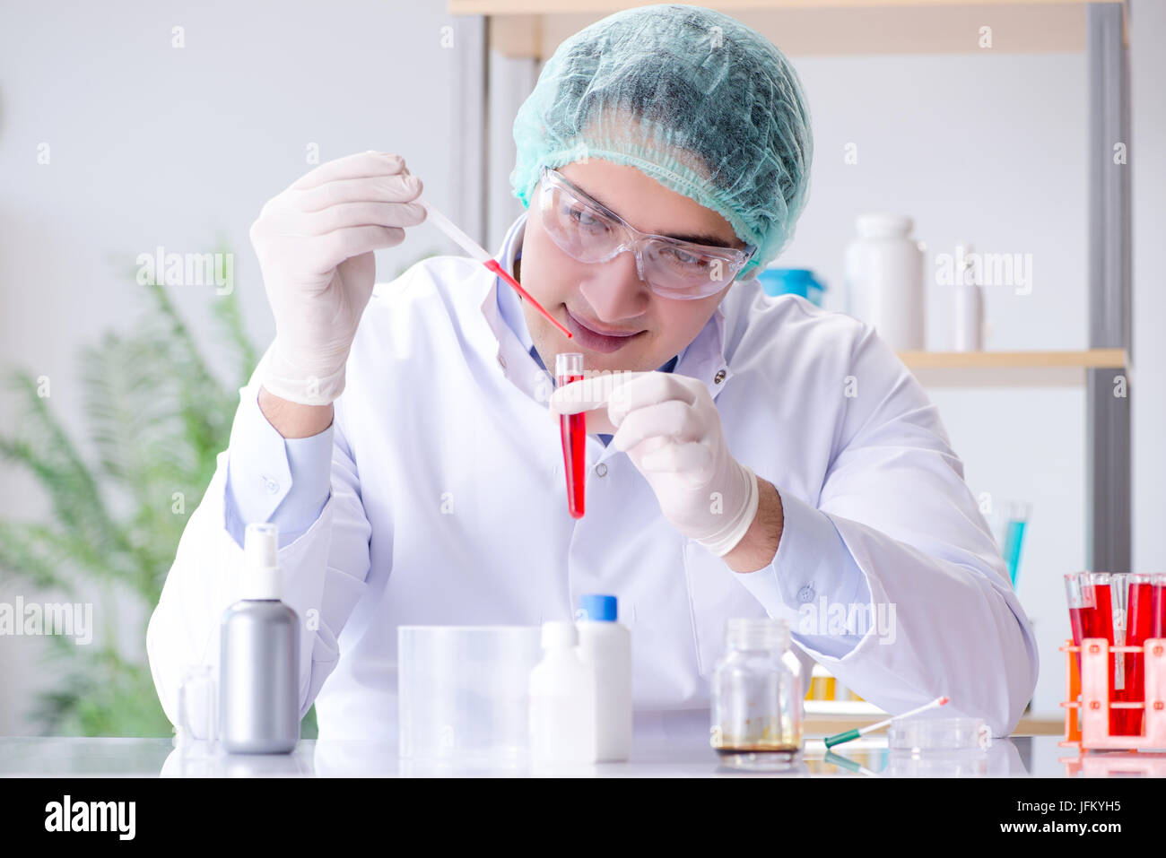 Blood testing in the lab with young scientist Stock Photo - Alamy