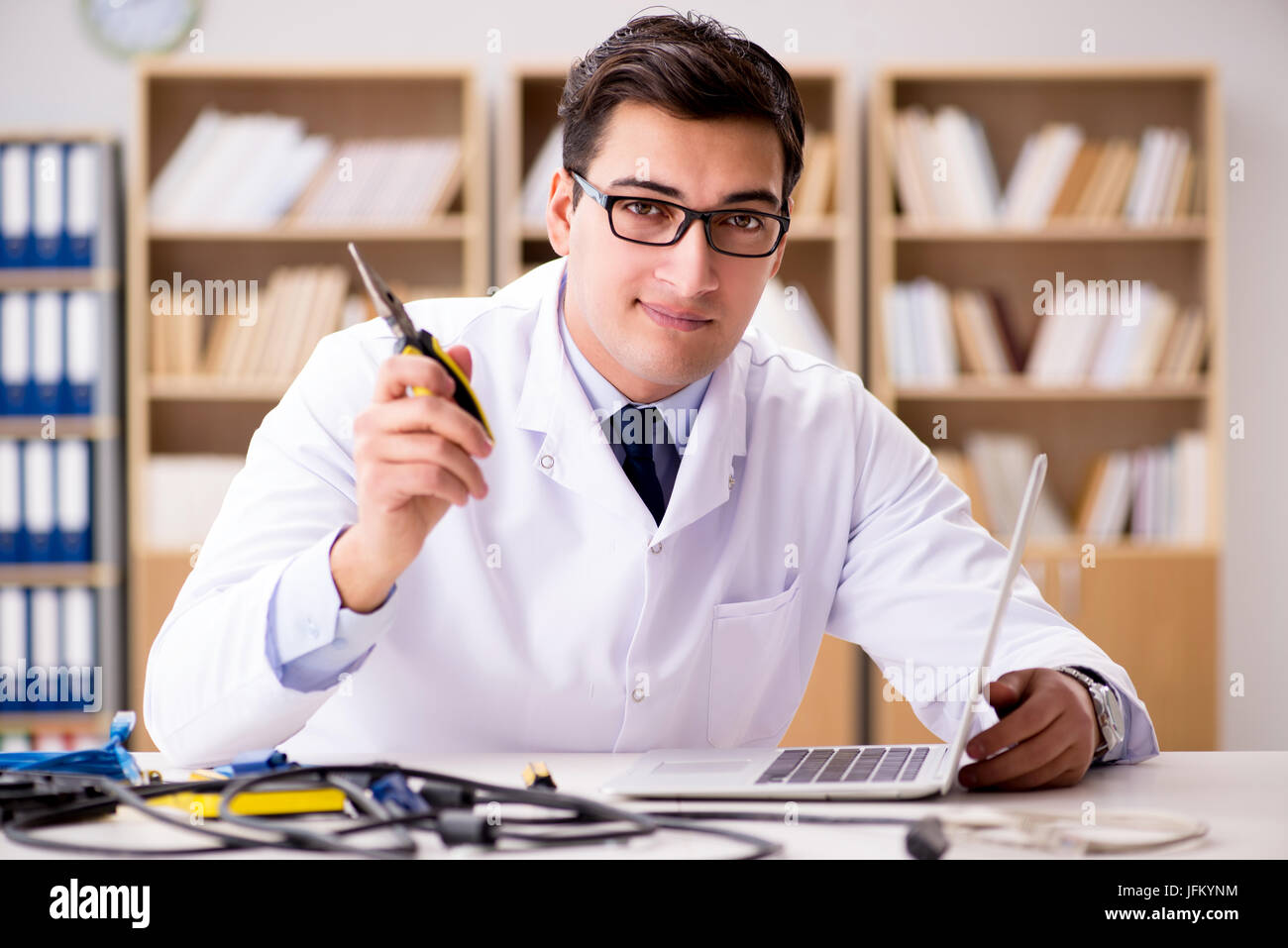 IT technician repairing broken laptop notebook computer Stock Photo - Alamy