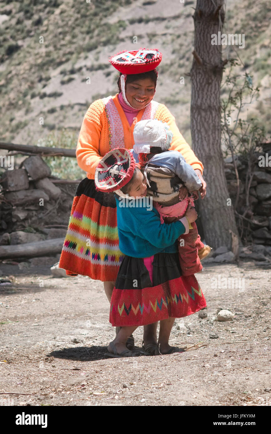 Native peruvian woman smilling and playing with her kids, October 21 ...