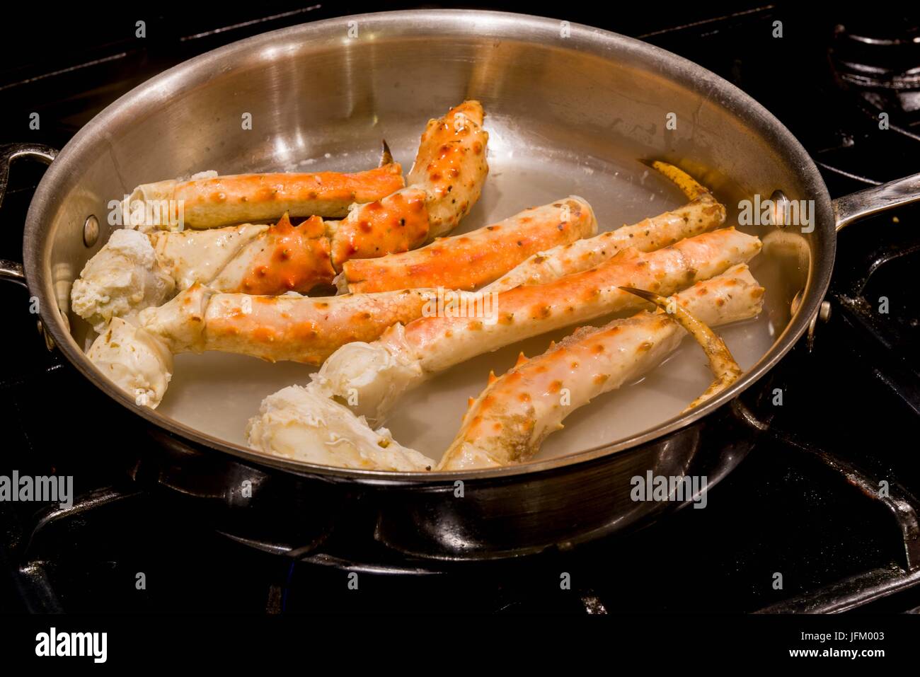 Crab legs being cooked Stock Photo - Alamy