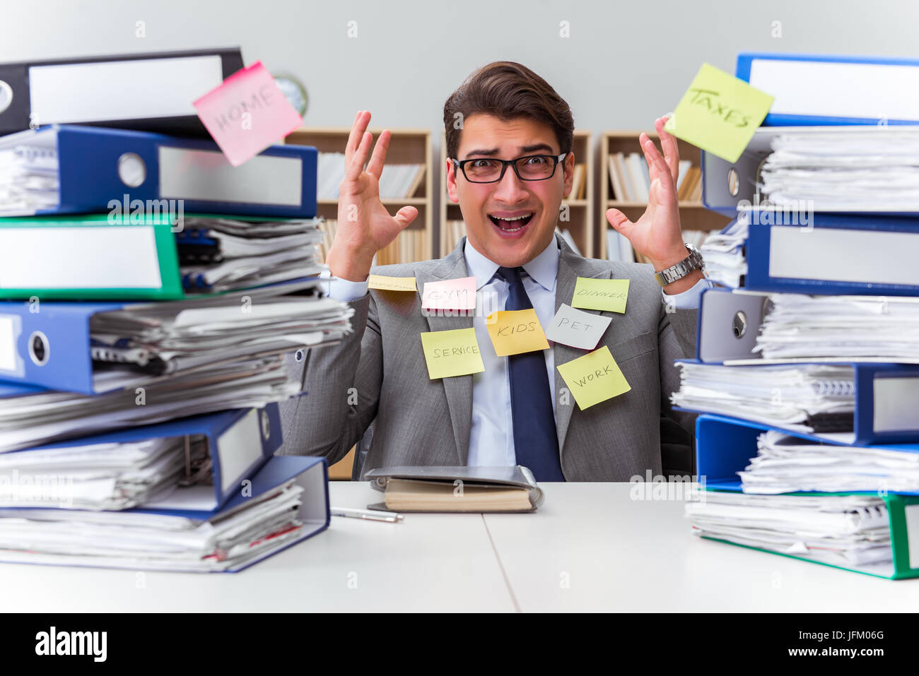 Businessman struggling with multiple priorities Stock Photo - Alamy