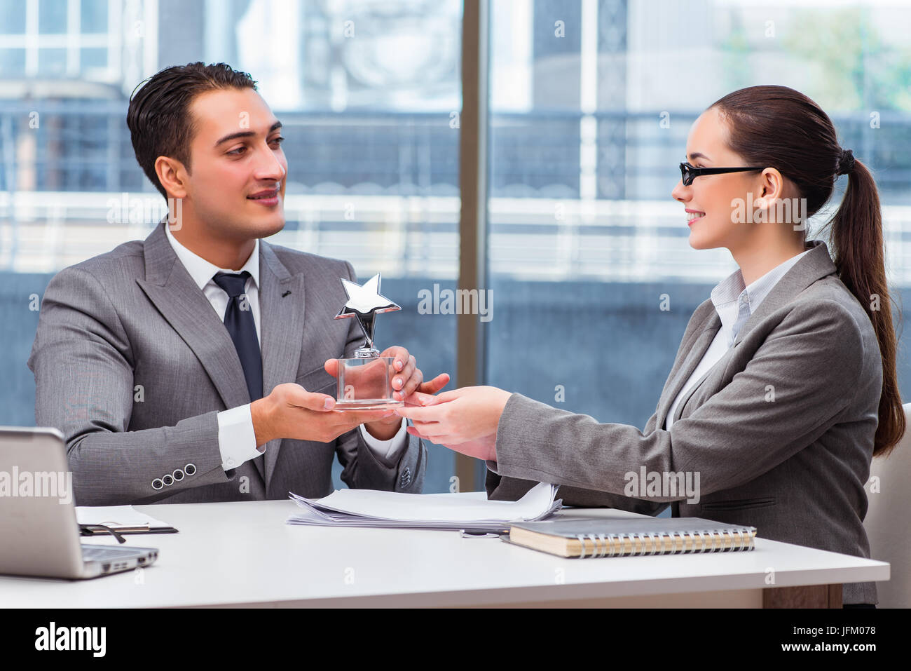 Businesspeople receiving award prize in office Stock Photo - Alamy