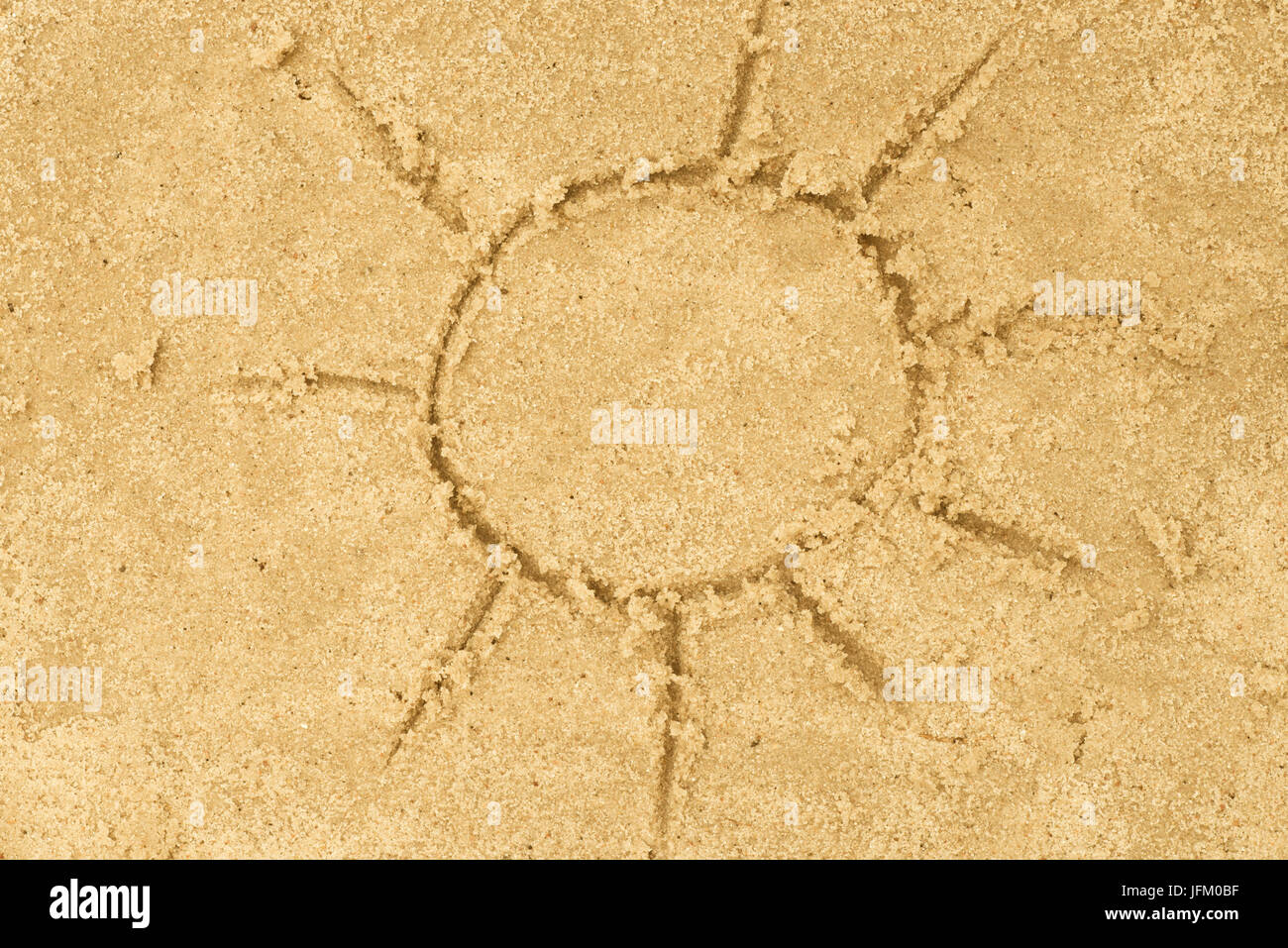 sun drawing in sand background Stock Photo - Alamy