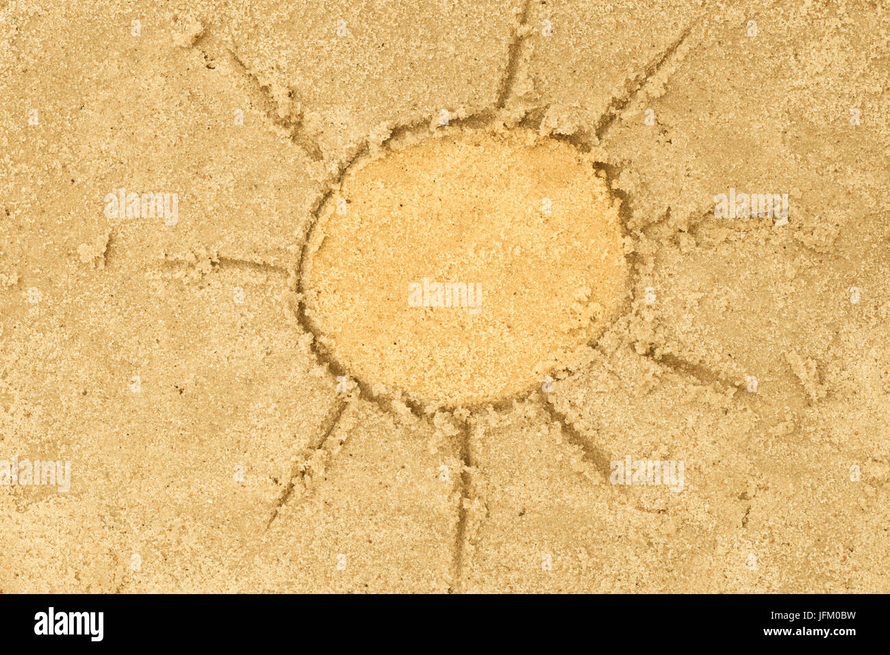 sun drawing in sand background Stock Photo - Alamy
