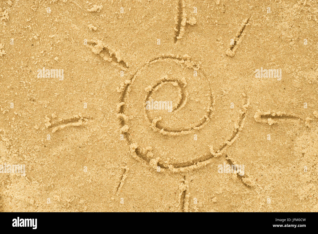 sun drawing in sand background Stock Photo - Alamy