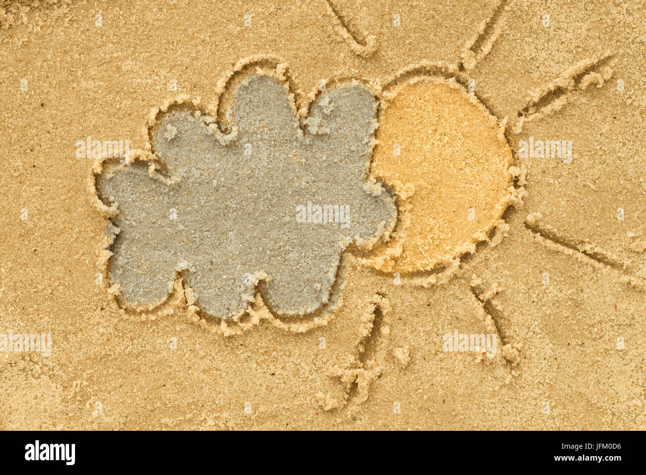 cloud and sun drawing in sand background Stock Photo - Alamy