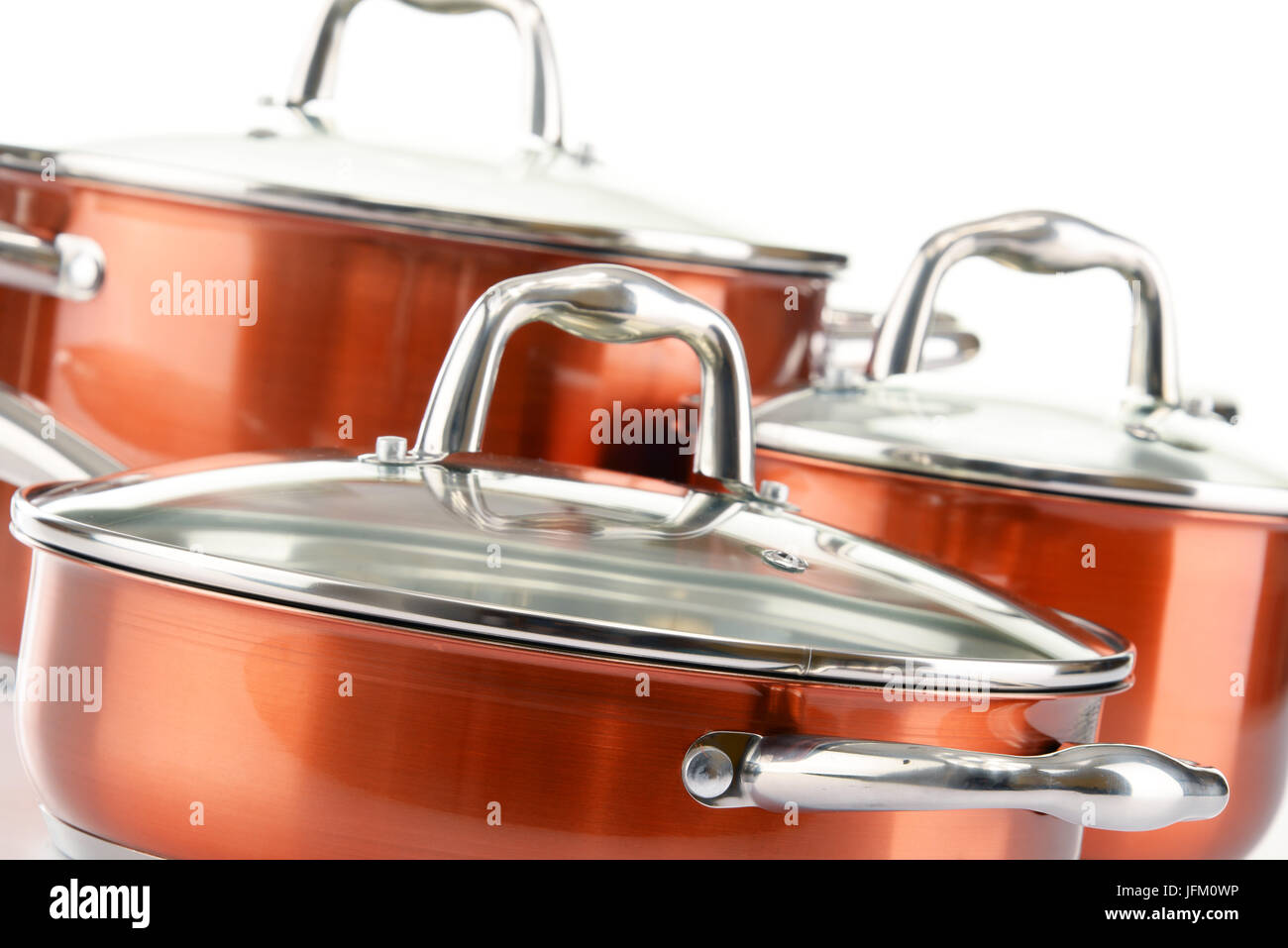 Composition with three steel pots Stock Photo - Alamy