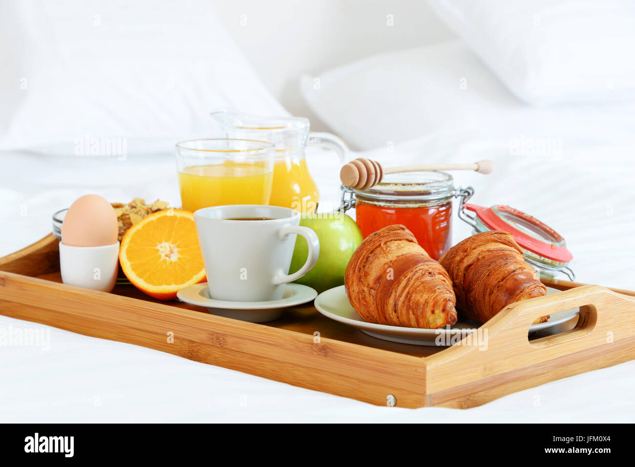 Breakfast in bed in hotel room. Accommodation Stock Photo - Alamy