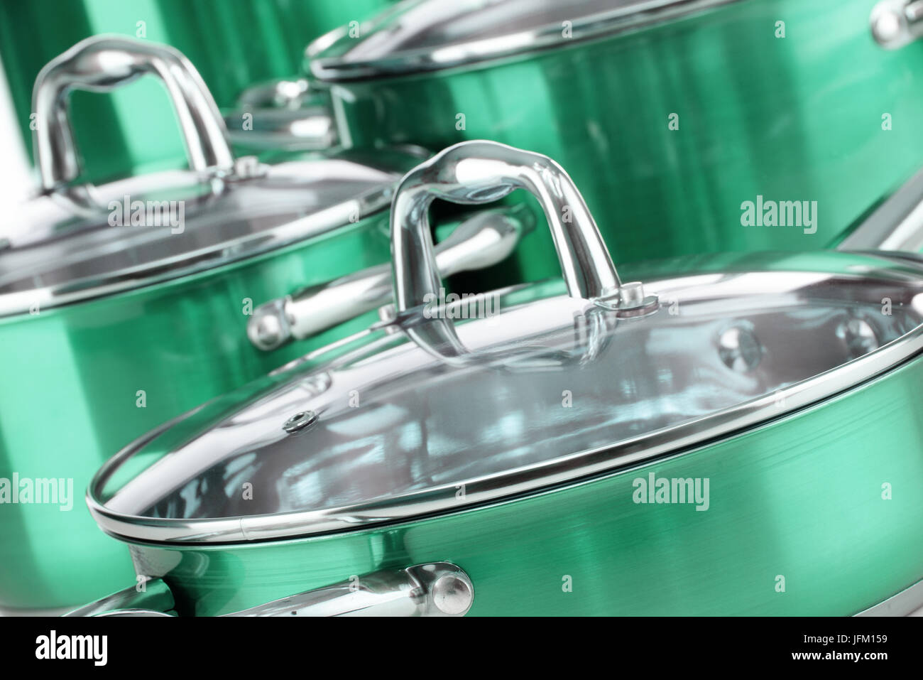 Composition with four steel pots Stock Photo - Alamy