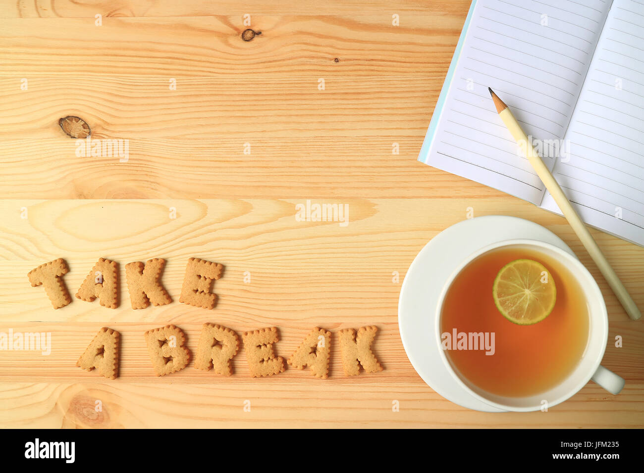 Hot Lemon Tea, Note Papers and Pencil beside with Word TAKE A BREAK ...