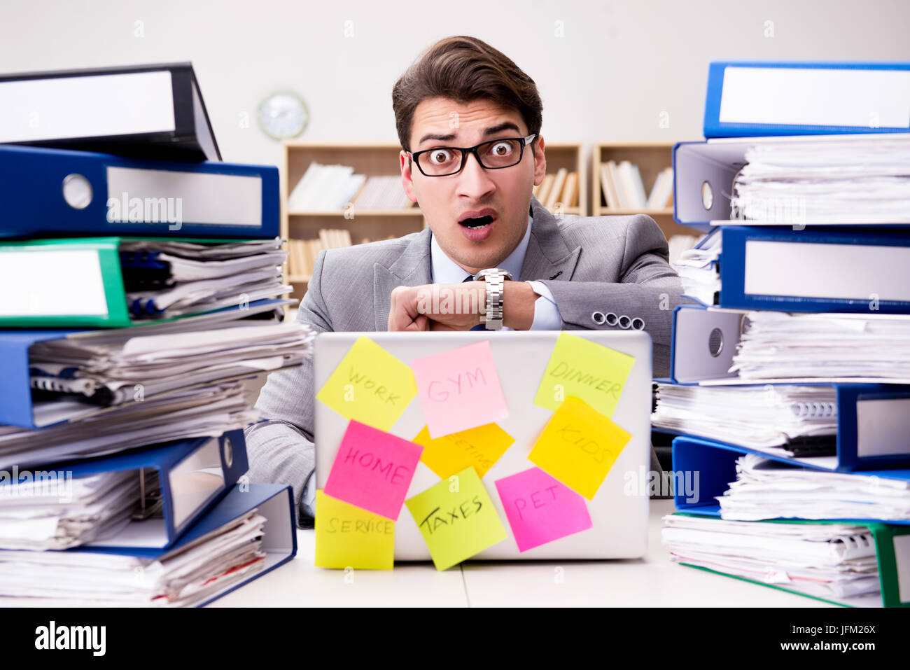 Businessman struggling with multiple priorities Stock Photo - Alamy