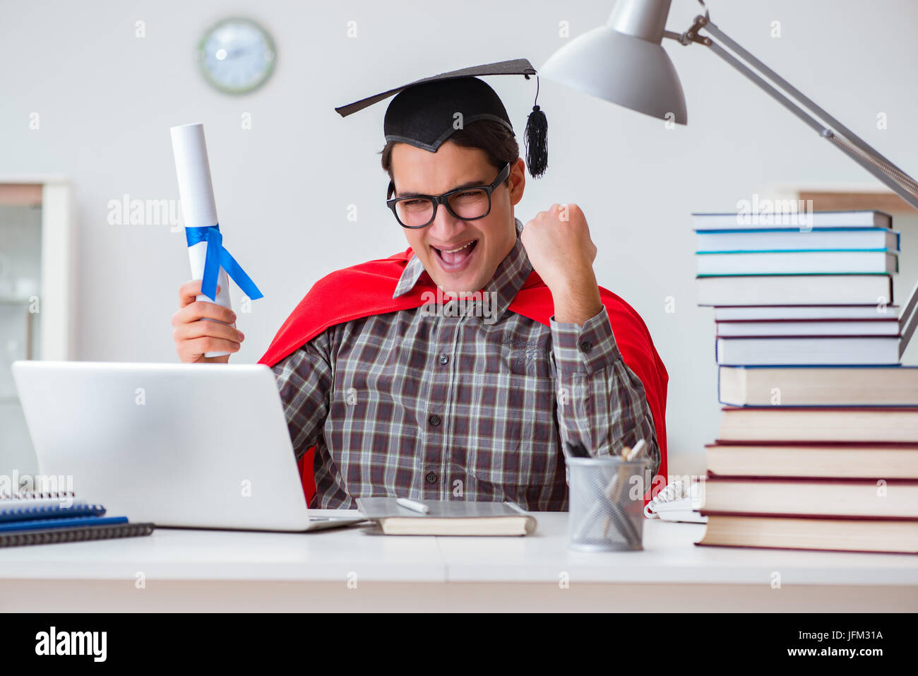 Super hero student with books studying for exams Stock Photo - Alamy