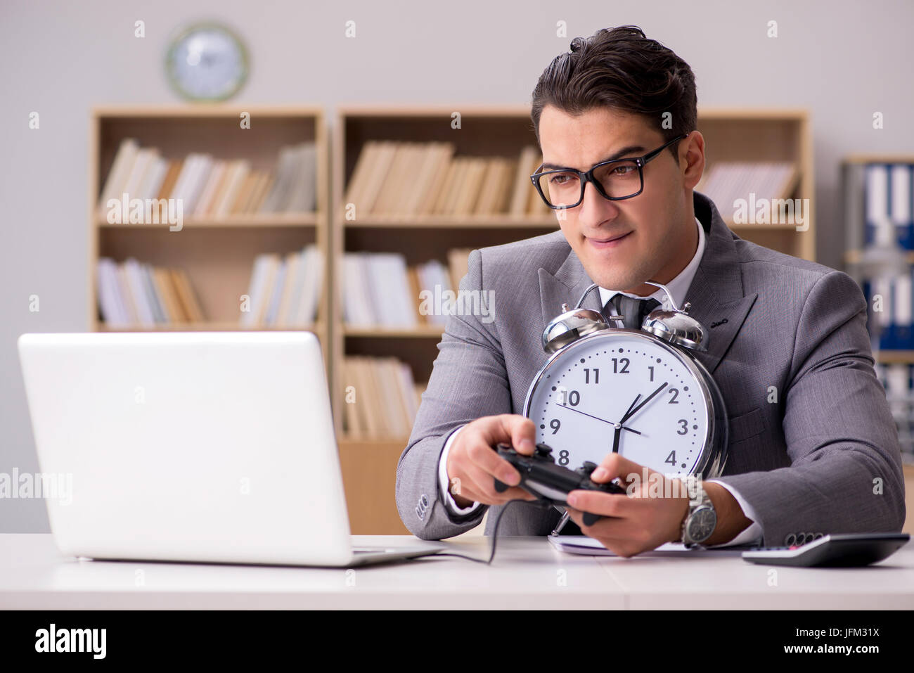 Businessman playing computer games at work office Stock Photo - Alamy