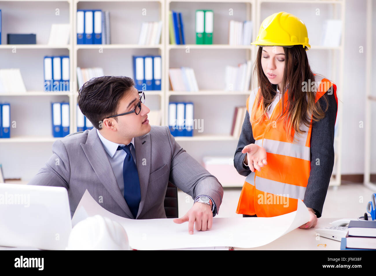 Construction foreman supervisor reviewing drawings Stock Photo - Alamy