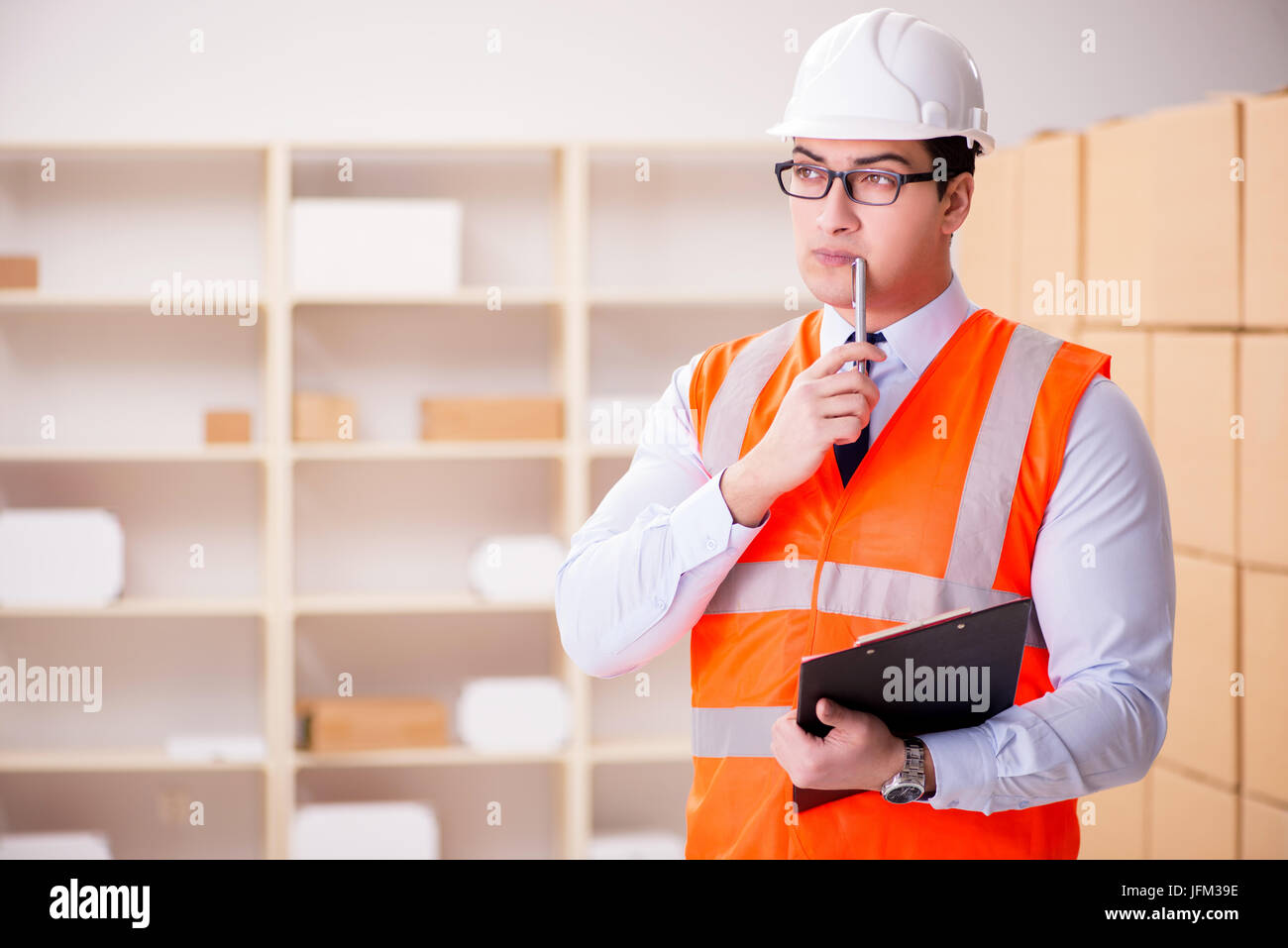 Man working in postal parcel delivery service office Stock Photo - Alamy