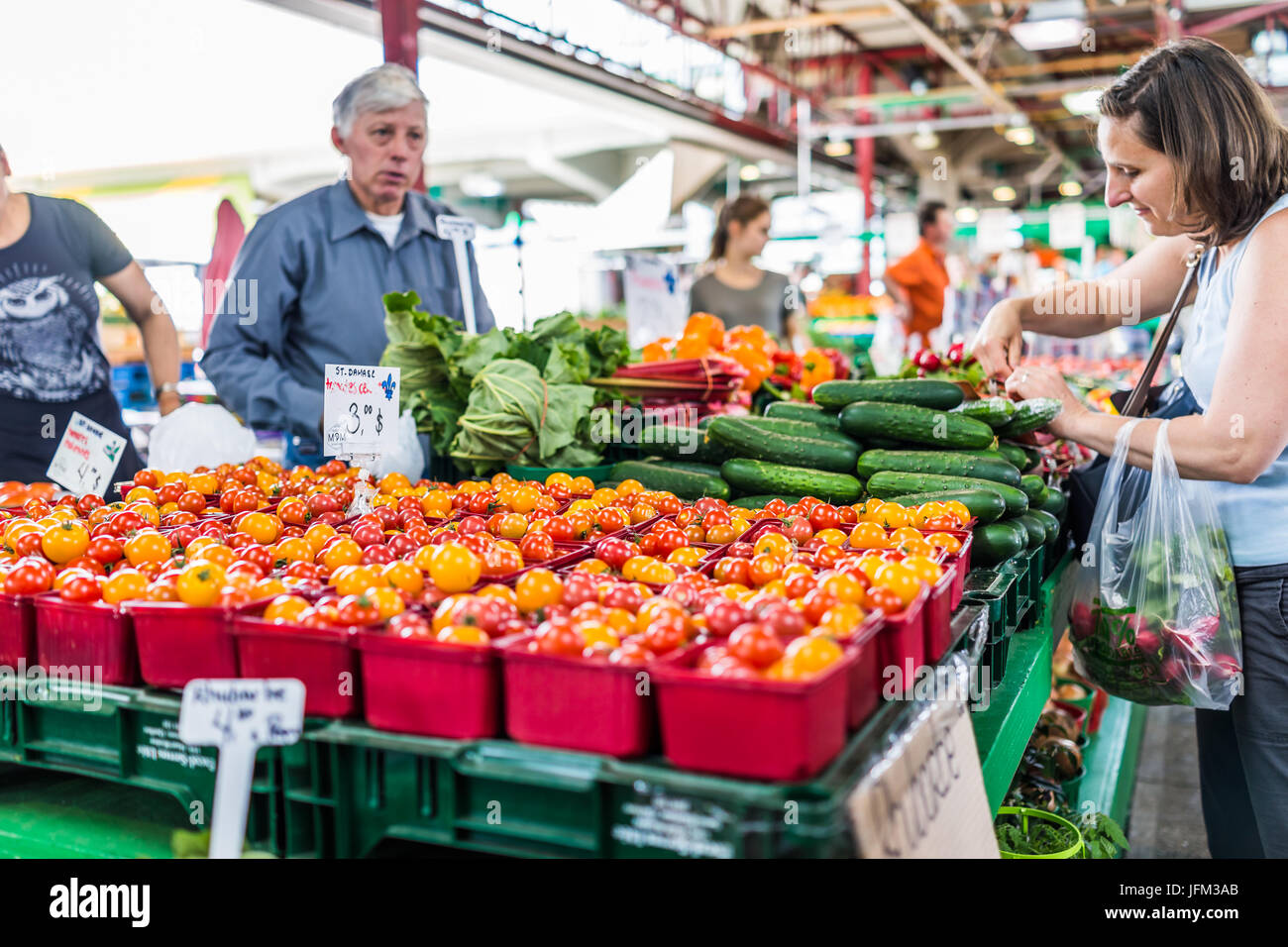 Montreal, Canada - May 28, 2017: Man selling produce by fruit stand ...