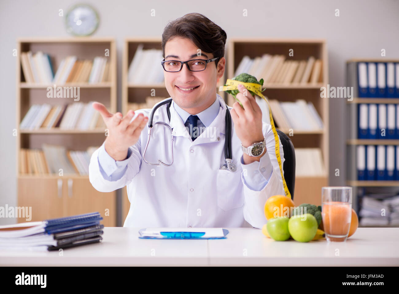Doctor in dieting concept with fruits and vegetables Stock Photo - Alamy