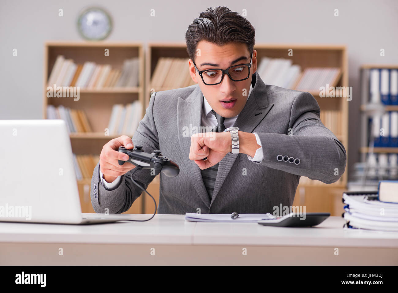 Businessman playing computer games at work office Stock Photo - Alamy