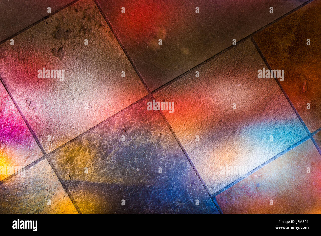 Stained glass reflection on stone wall hi-res stock photography and ...
