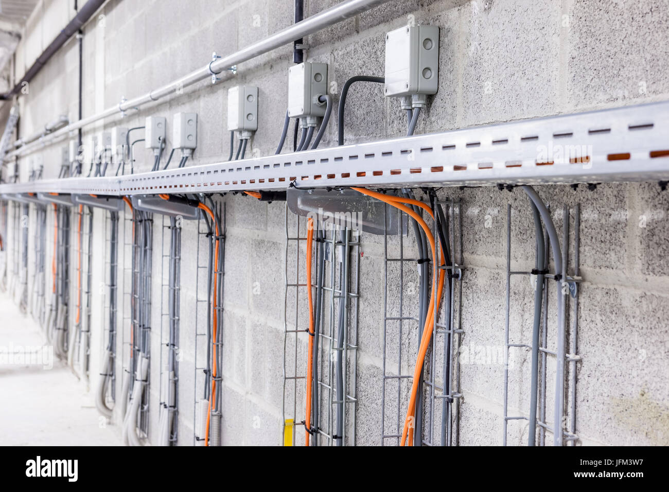 Electrical cables are located in a cableway in a building Stock Photo ...