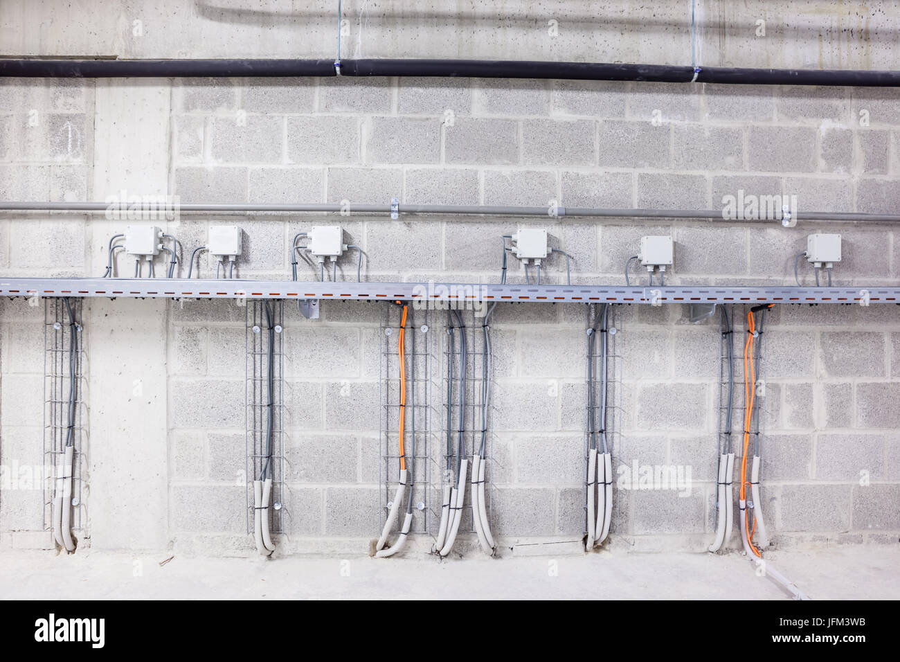 Electrical cables are located in a cableway in a building Stock Photo ...