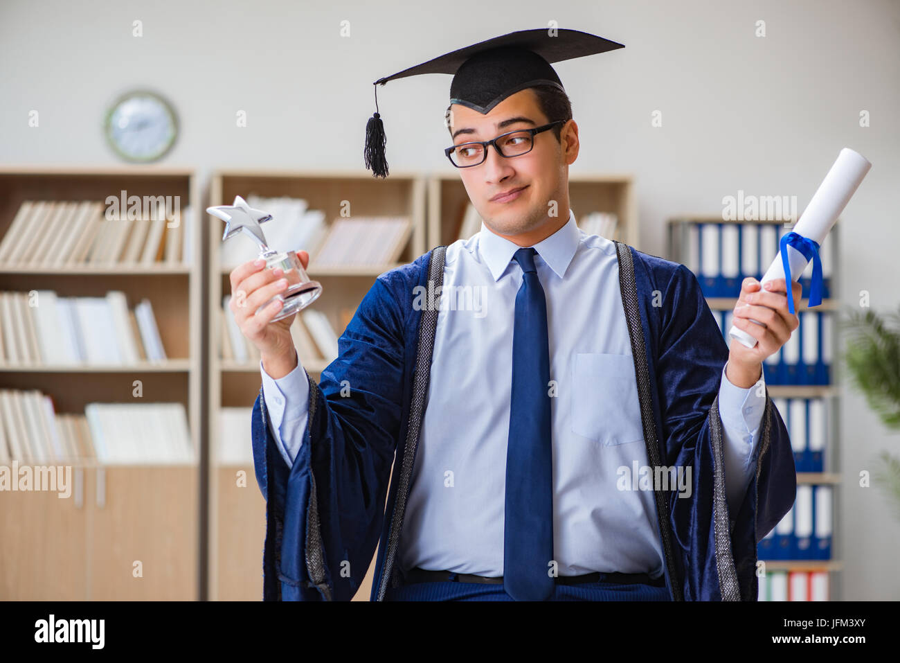 Young man graduating from university Stock Photo - Alamy