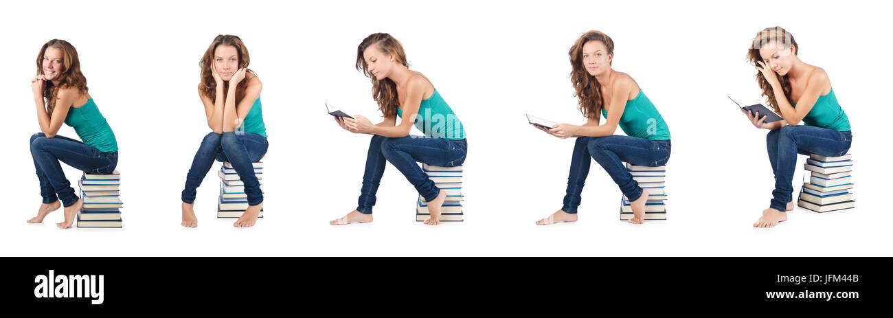 Student sitting on stack of books Stock Photo - Alamy