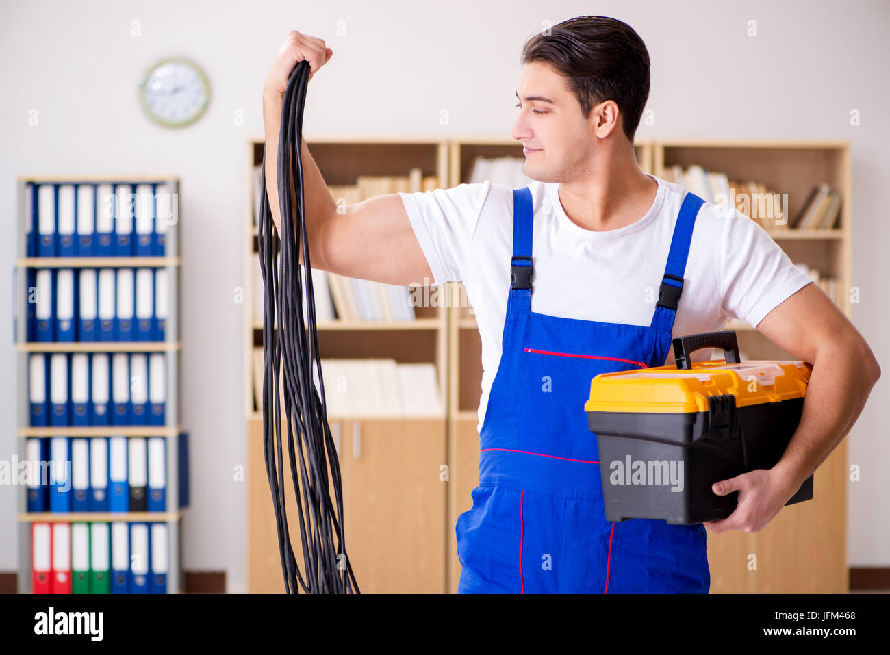 Man doing electrical repairs at home Stock Photo - Alamy