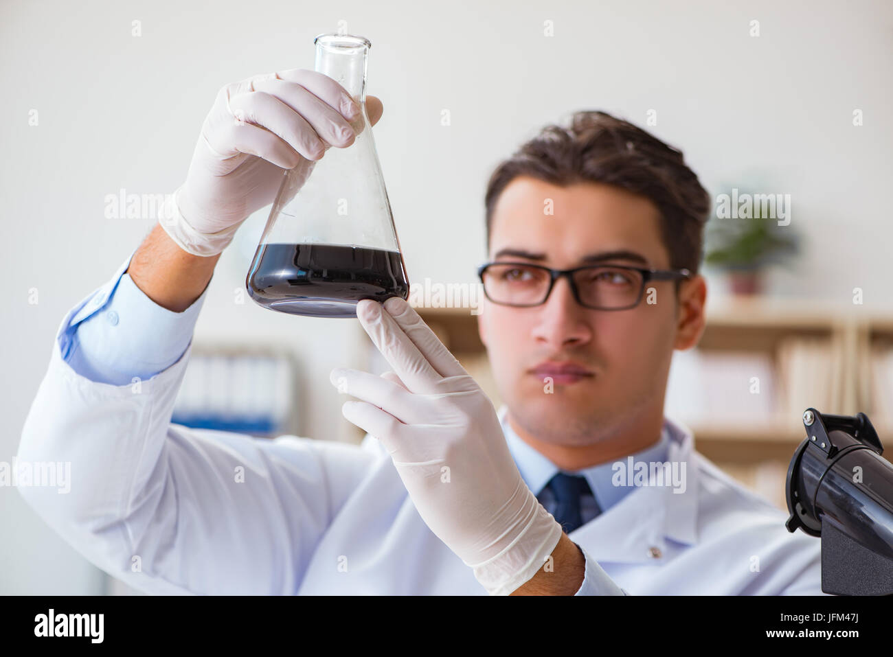 Chemical engineer working on oil samples in lab Stock Photo - Alamy