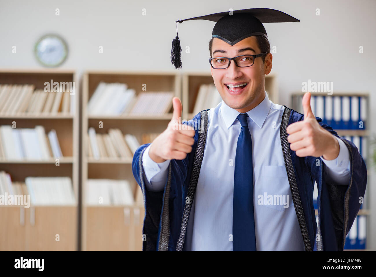 Young man graduating from university Stock Photo - Alamy