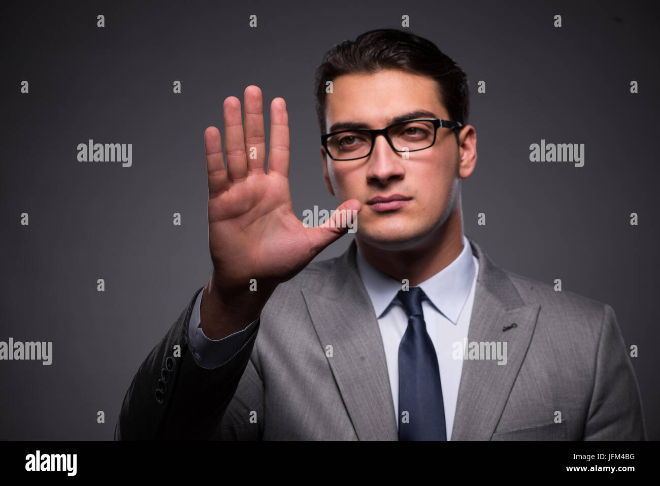 Handsome businessman pressing virtual buttons Stock Photo - Alamy