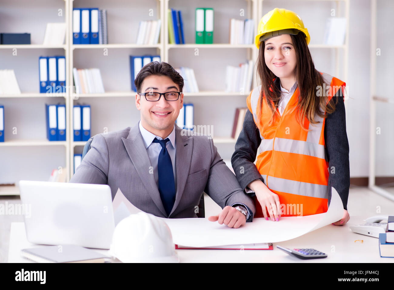 Construction foreman supervisor reviewing drawings Stock Photo - Alamy