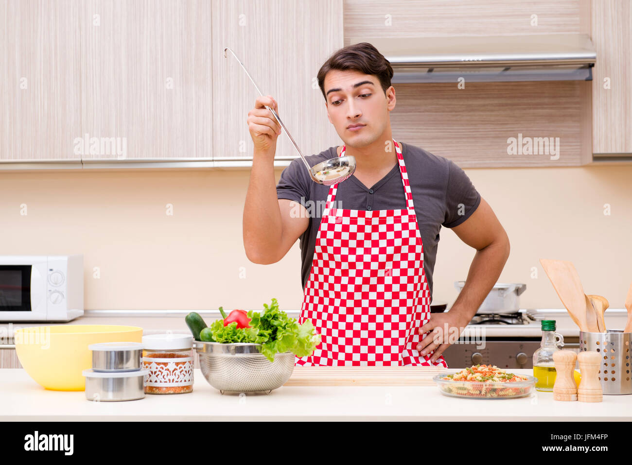 Man male cook preparing food in kitchen Stock Photo - Alamy