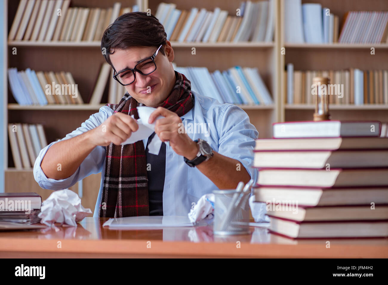 Young book writer writing in library Stock Photo - Alamy