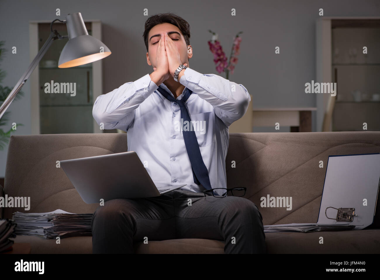 Businessman workaholic working late at home Stock Photo - Alamy