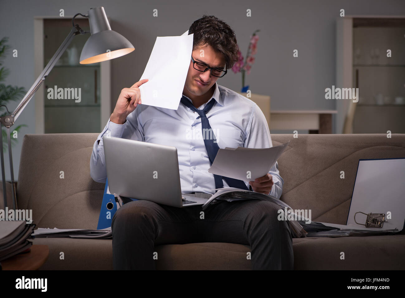 Businessman workaholic working late at home Stock Photo - Alamy