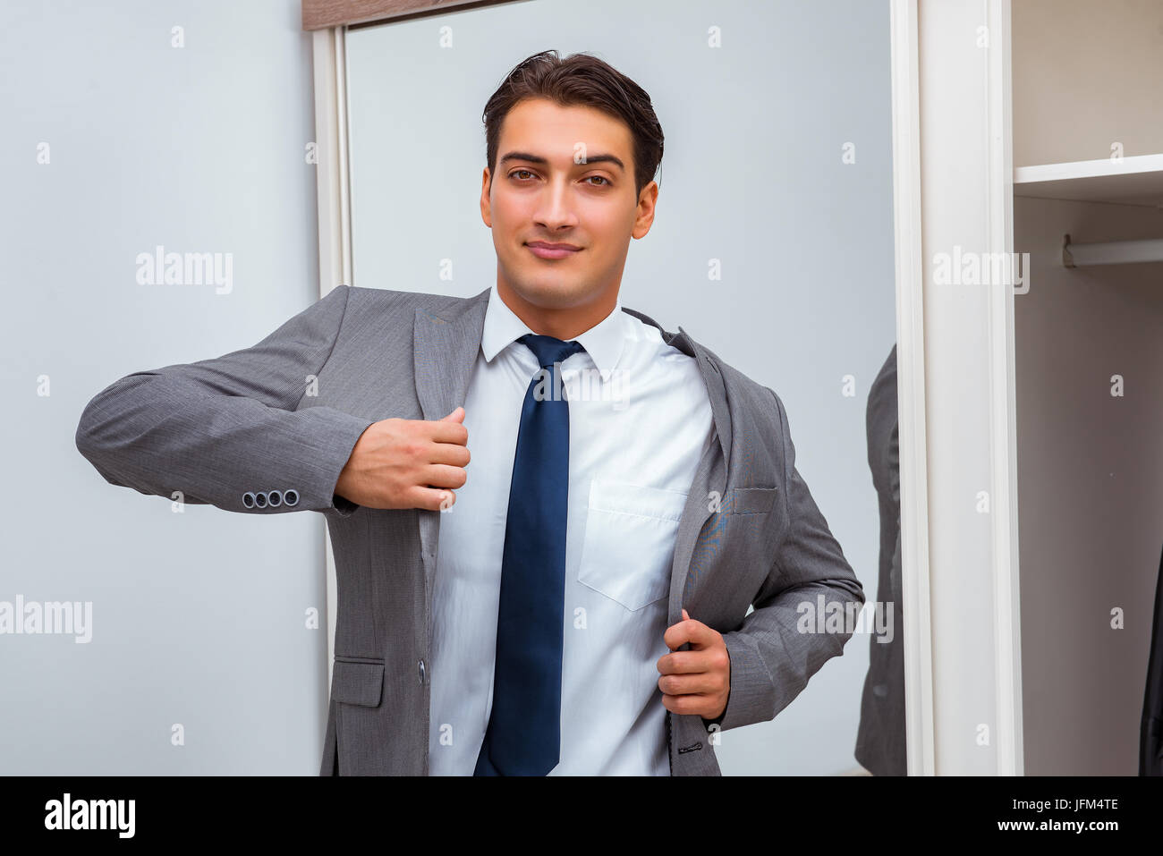 Businessman dressing up for work Stock Photo - Alamy