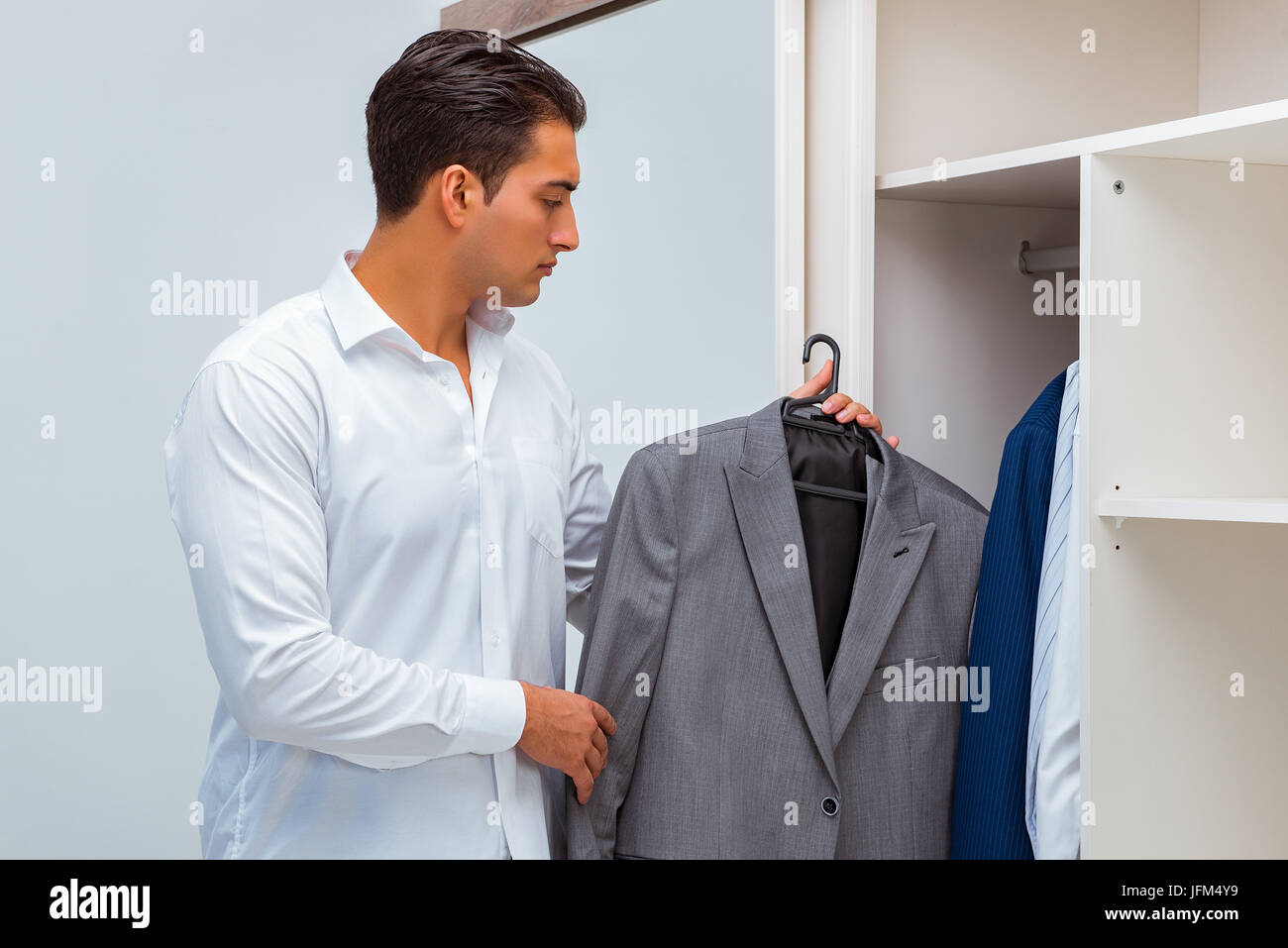 Businessman dressing up for work Stock Photo - Alamy