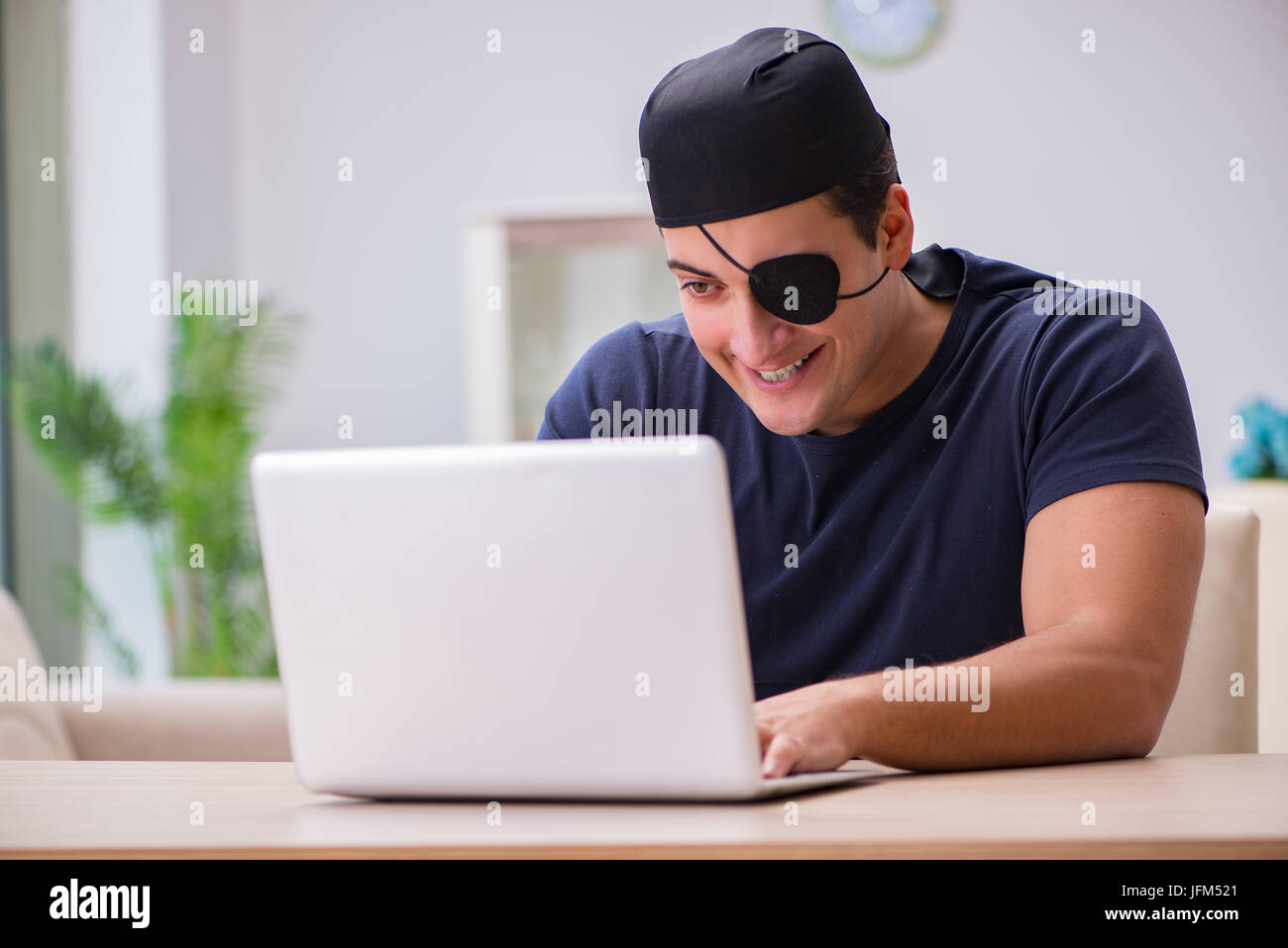 Digital security concept with pirate at computer Stock Photo - Alamy