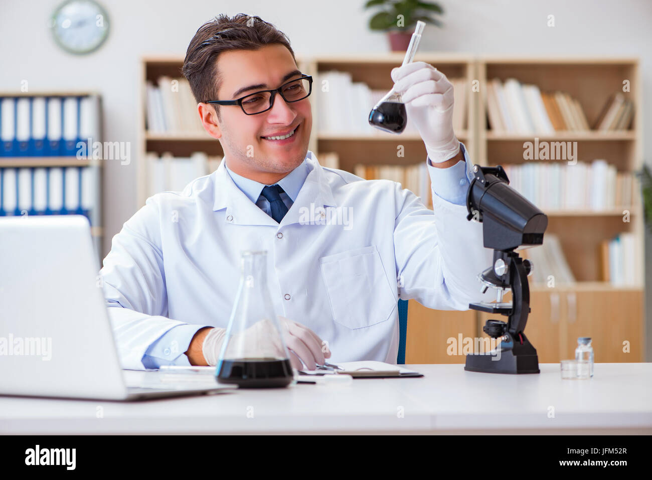 Chemical engineer working on oil samples in lab Stock Photo - Alamy