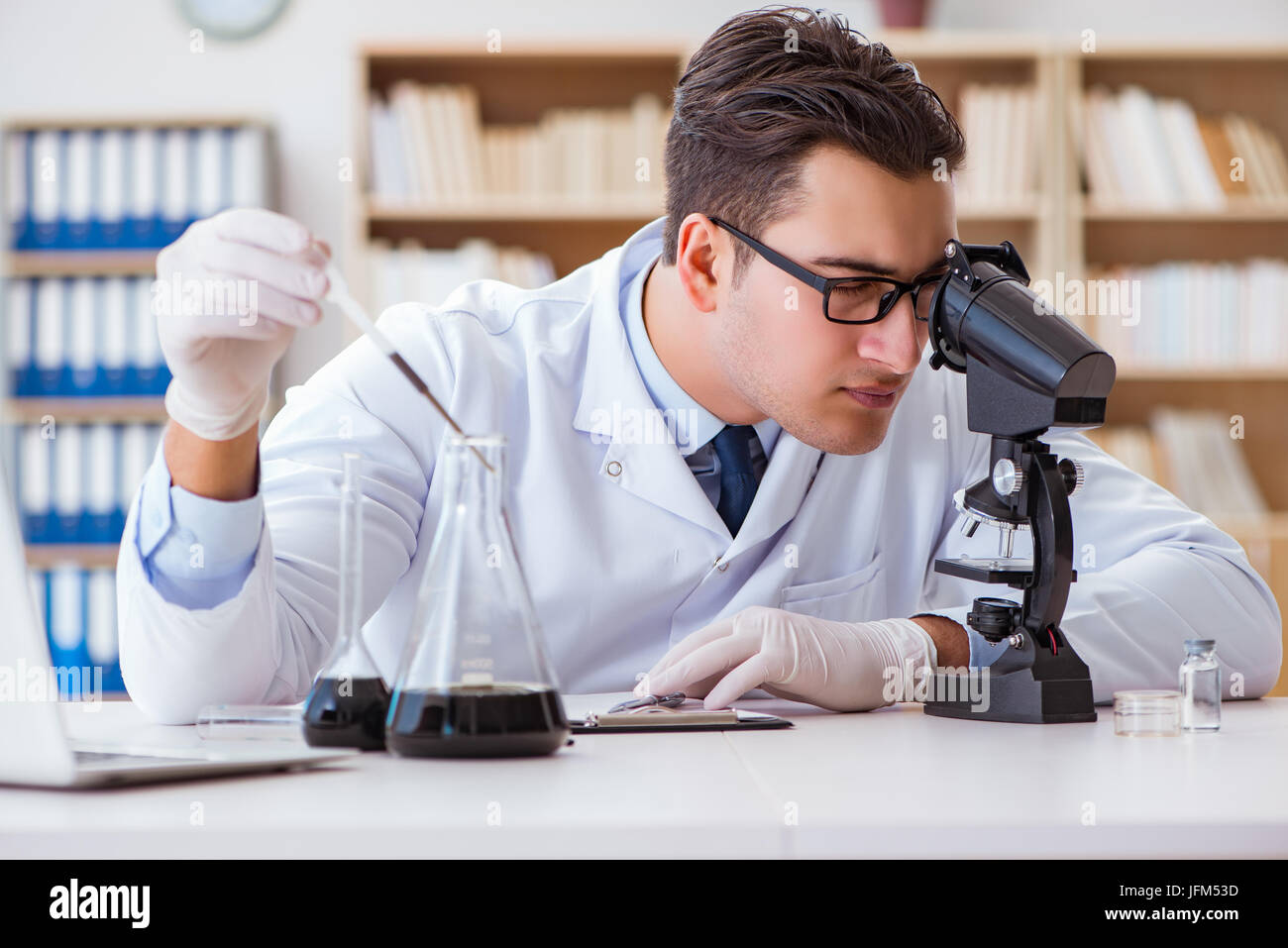 Chemical engineer working on oil samples in lab Stock Photo - Alamy