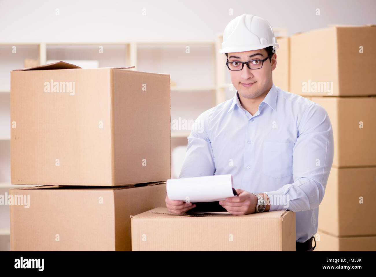 Man working in box delivery relocation service Stock Photo - Alamy