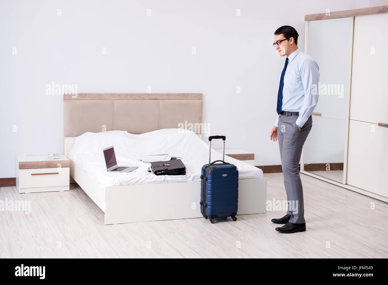 Businessman working in hotel room Stock Photo - Alamy