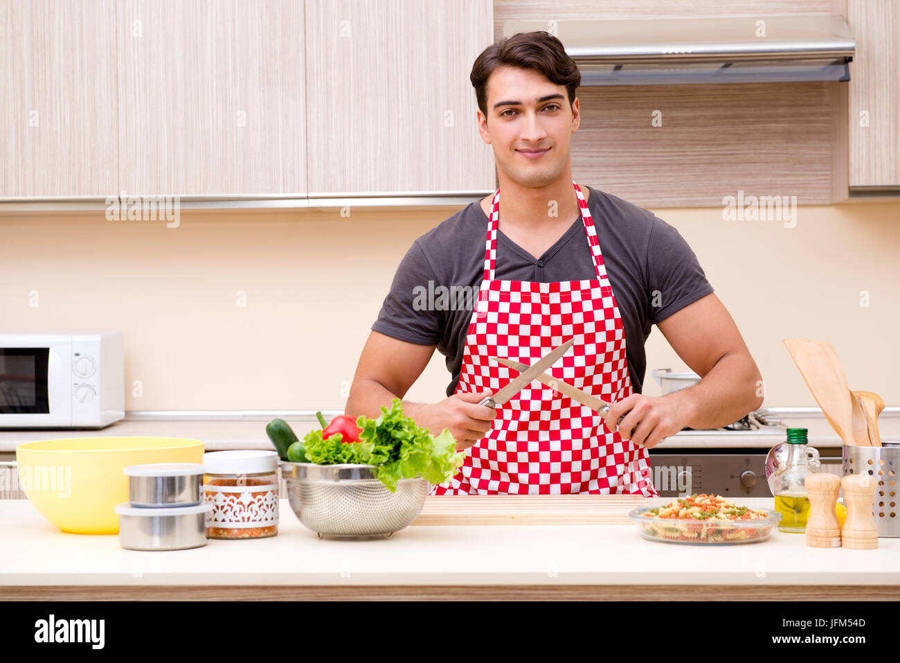 Man male cook preparing food in kitchen Stock Photo - Alamy