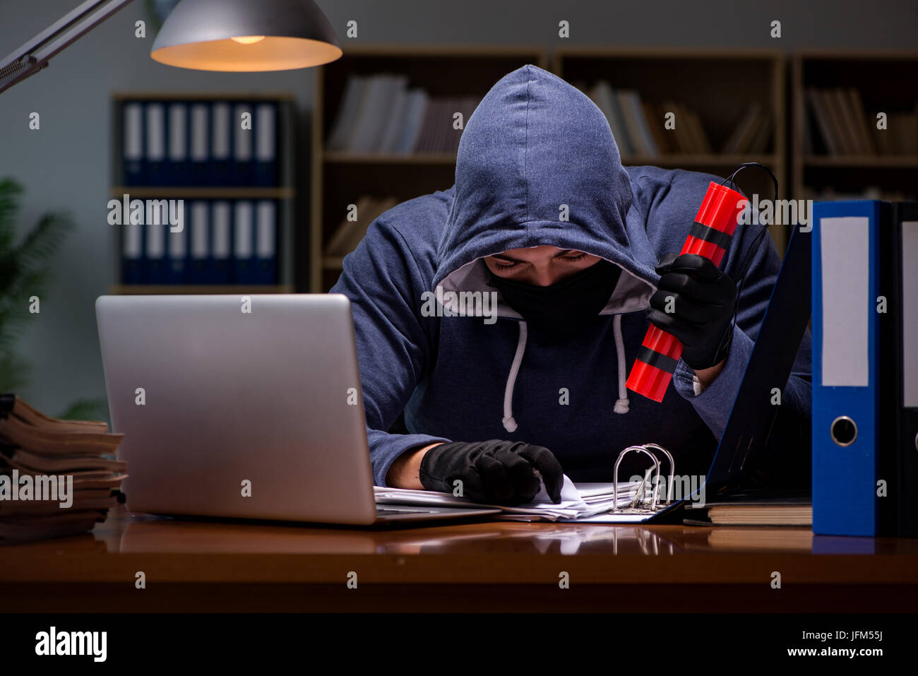 Hacker with dynamite stealing data Stock Photo - Alamy
